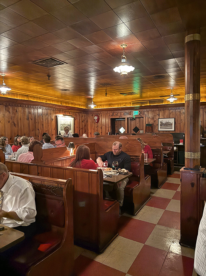 These wooden booths have witnessed more celebrations, business deals, and first dates than a Vegas wedding chapel – with better food.