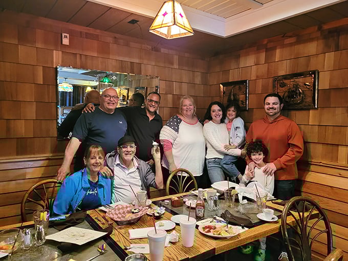 Happy diners gathered around a table laden with seafood treasures—the universal expression of "we ordered exactly right" on display.