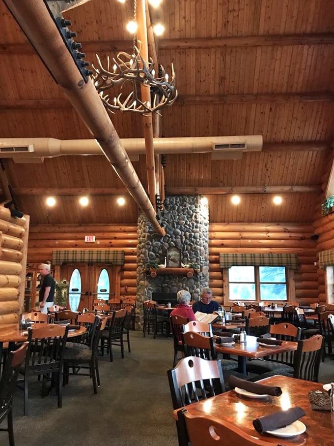 Antler chandeliers and stone fireplaces – this isn't just dinner, it's a mountain dining experience worth writing home about.