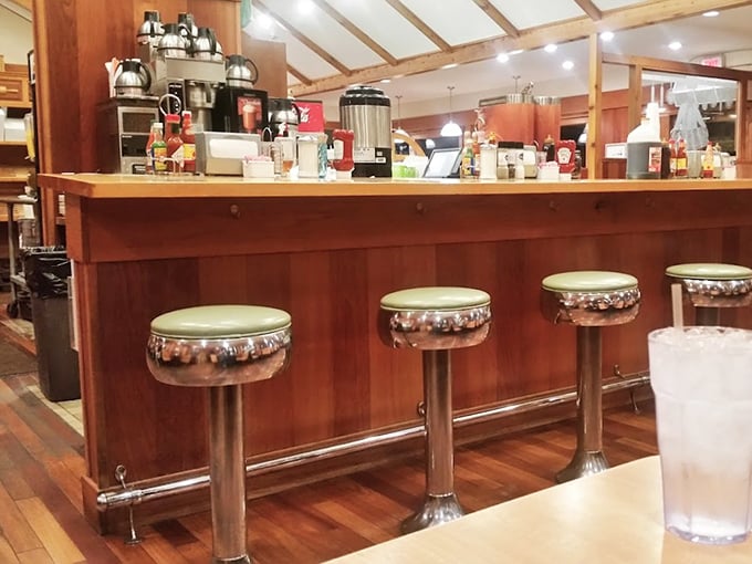 The counter where magic happens. Those chrome stools have witnessed countless first dates, family reunions, and "I shouldn't but I will" dessert decisions.