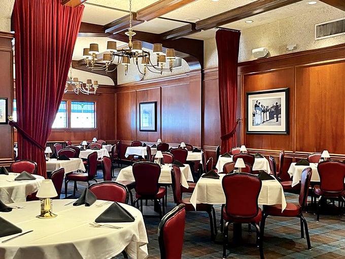 Red velvet chairs and white tablecloths create the perfect stage for culinary drama, where every meal feels like a special occasion.