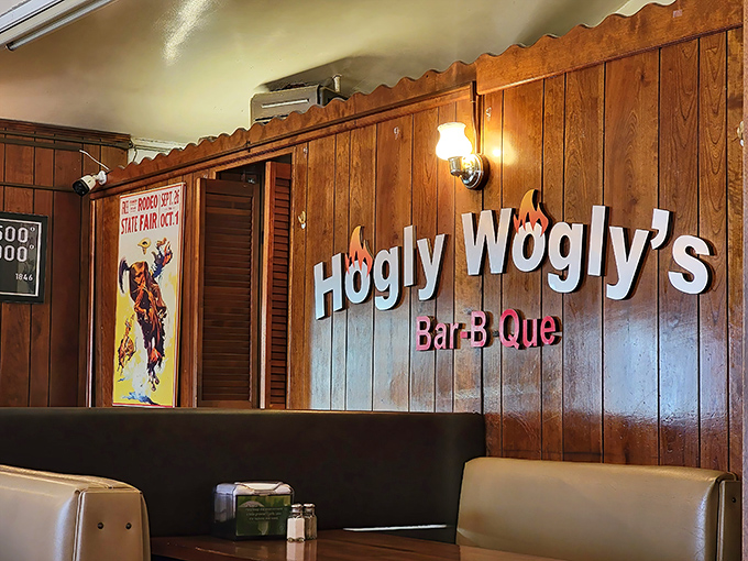 The wall sign glows like a beacon of BBQ hope. This isn't just decoration—it's a promise of deliciousness to come.