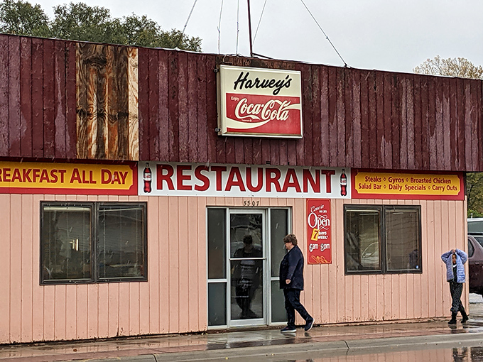 Rain can't keep the faithful away from Harvey's—this entrance has welcomed generations of Sioux City residents seeking shelter from storms and hunger pangs alike.