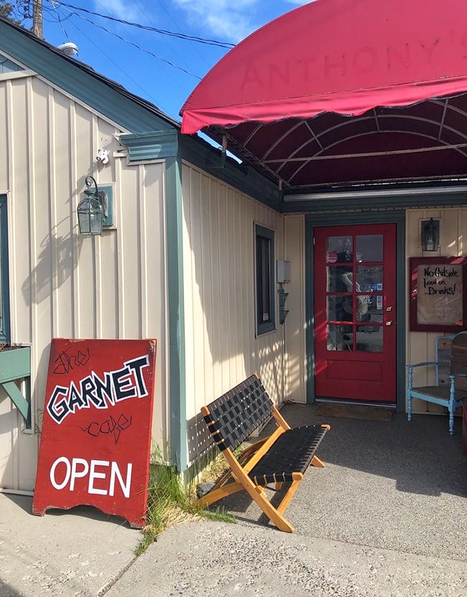 The red door and handwritten "OPEN" sign might as well say "Happiness served daily"—a promise The Garnet Cafe delivers on with every plate.