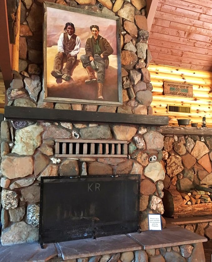The stone fireplace anchors the room like a mountain sentinel. That painting above? A visual appetizer before the main course arrives.