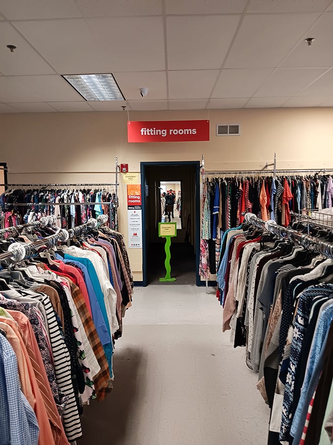 The fitting room corridor – where fashion dreams either soar or crash spectacularly. The truth awaits behind that humble doorway. 