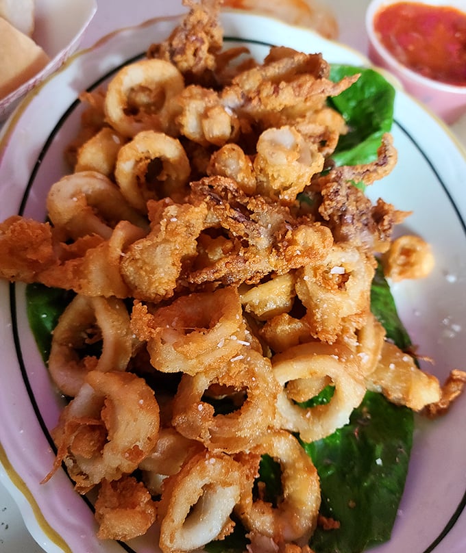 Calamari that doesn't need fancy plating or pretentious sauces—just a perfect golden crunch and a side of marinara for dipping.