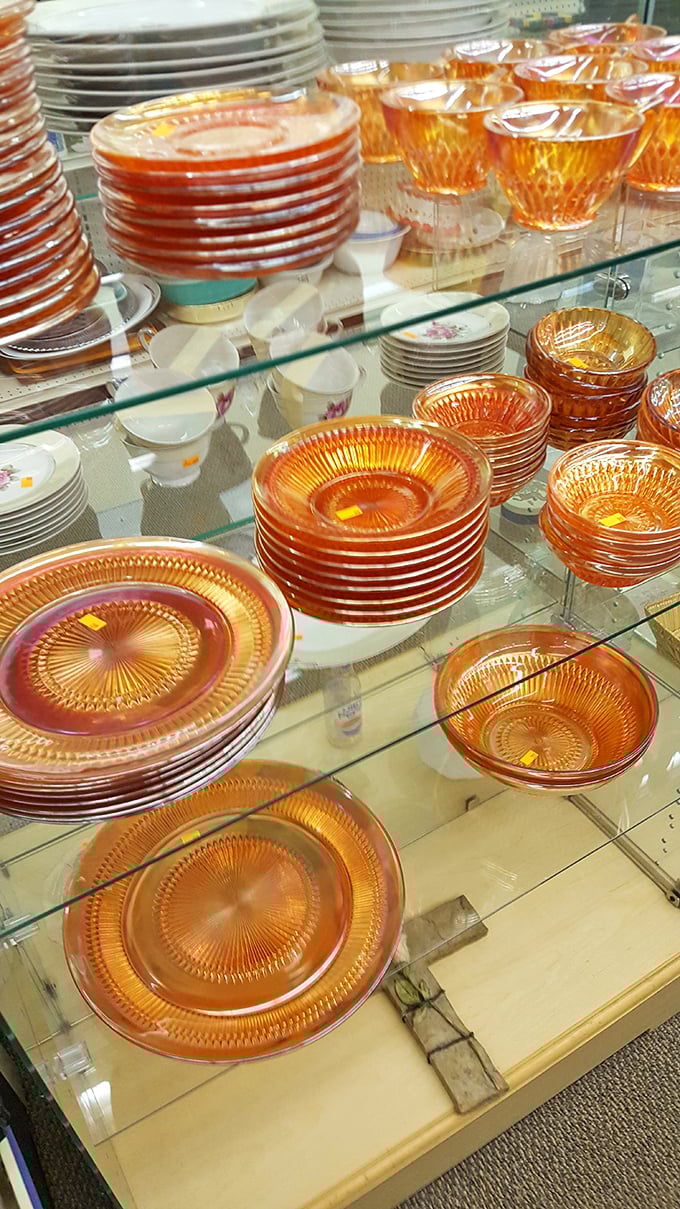 Amber glassware catching the light like liquid sunshine – your grandmother would approve of these Depression-era treasures.