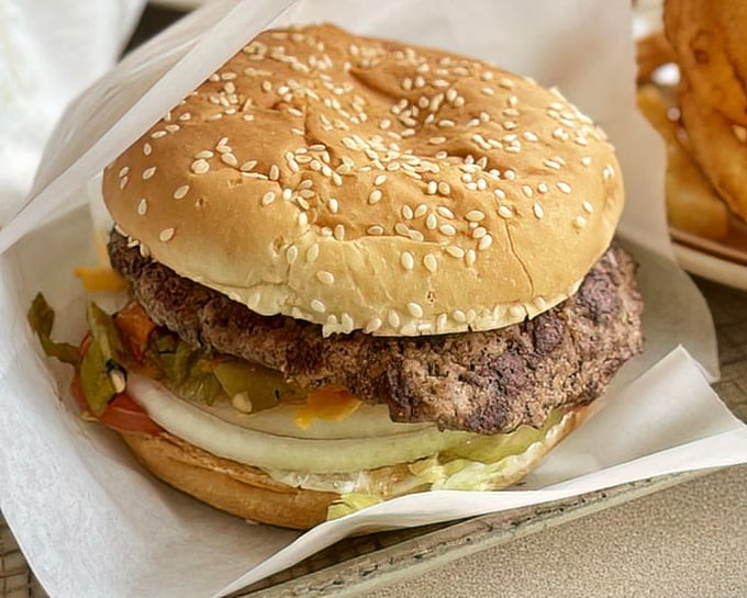 Not just any burger – a proper New Mexican green chile cheeseburger that makes you question why anyone would eat a burger any other way.
