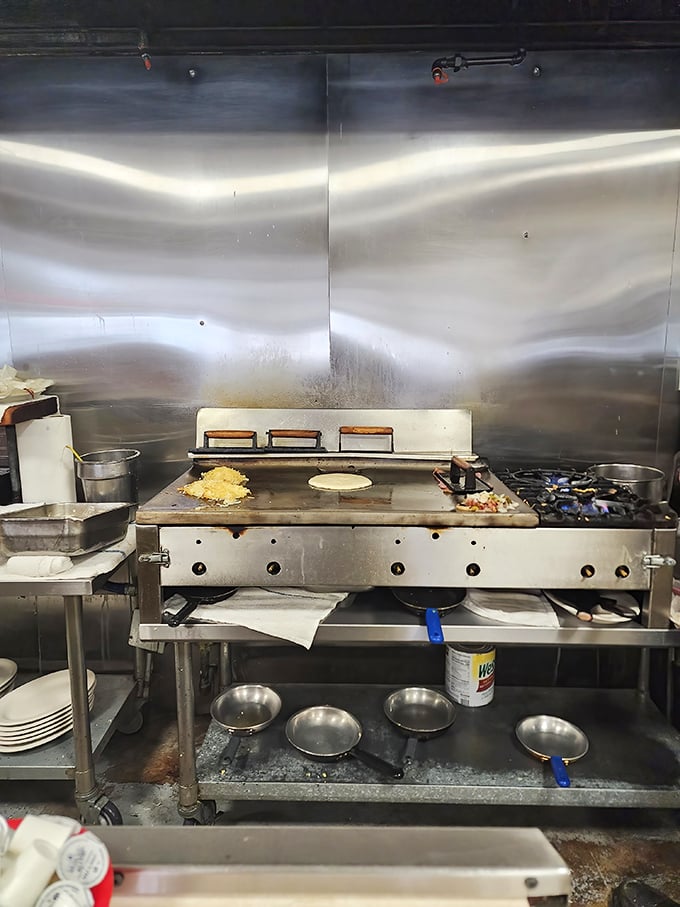 The flat-top grill—hallowed ground where ordinary ingredients undergo their transformation into extraordinary meals through heat and skill.