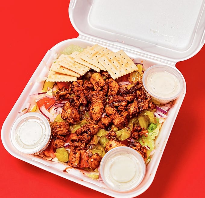 Who knew healthy could look this good? Seasoned chicken atop fresh greens – the kind of salad that doesn't feel like punishment.