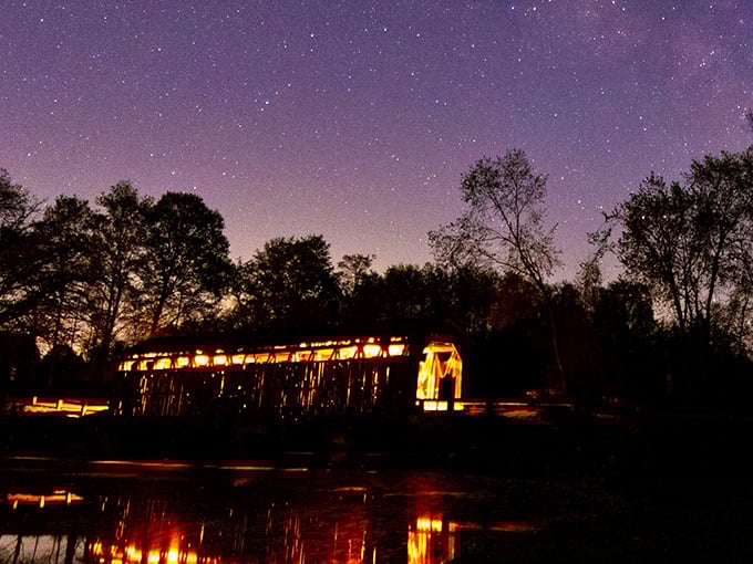 Under starry skies, the illuminated bridge takes on an almost magical quality – history that glows in the Michigan darkness.