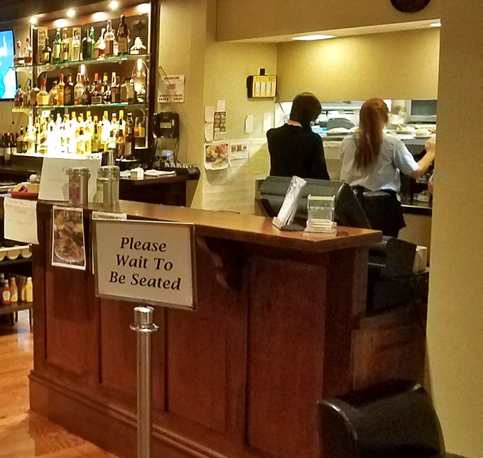 "Please Wait To Be Seated" – four words that promise good things come to those who wait, especially with that well-stocked bar in view.