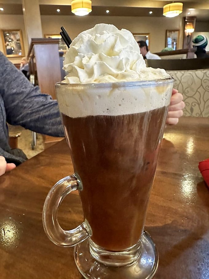 That's not just coffee – it's a warm hug in a glass. The whipped cream mountain on top is your invitation to indulge.