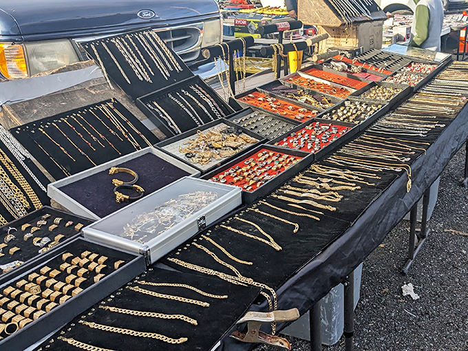 Jewelry displayed like a pirate's bounty – gold chains gleaming in the sun, waiting for their next adventure around someone's neck.