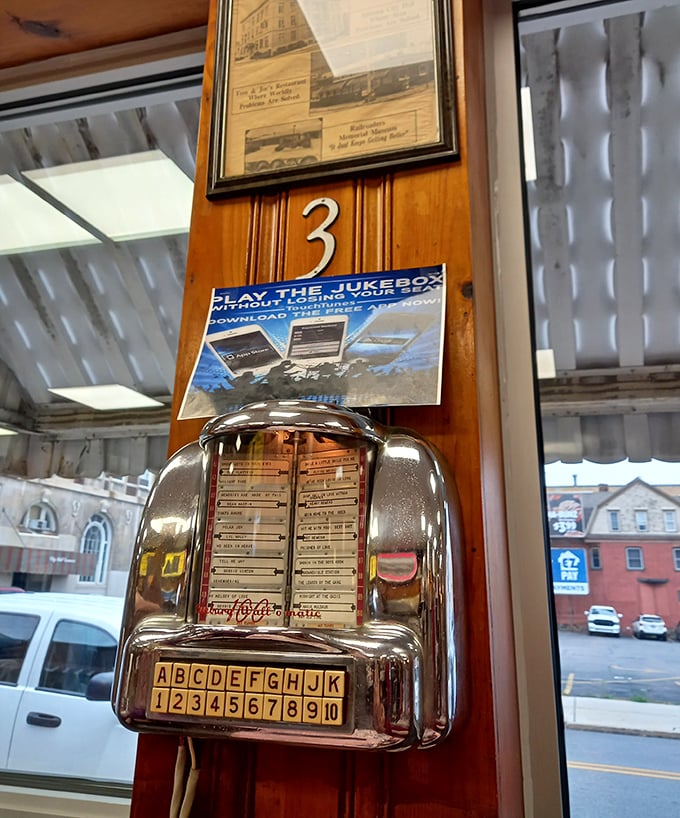 The tabletop jukebox—a portal to simpler times. For the price of a quarter, you can soundtrack your breakfast with memories.
