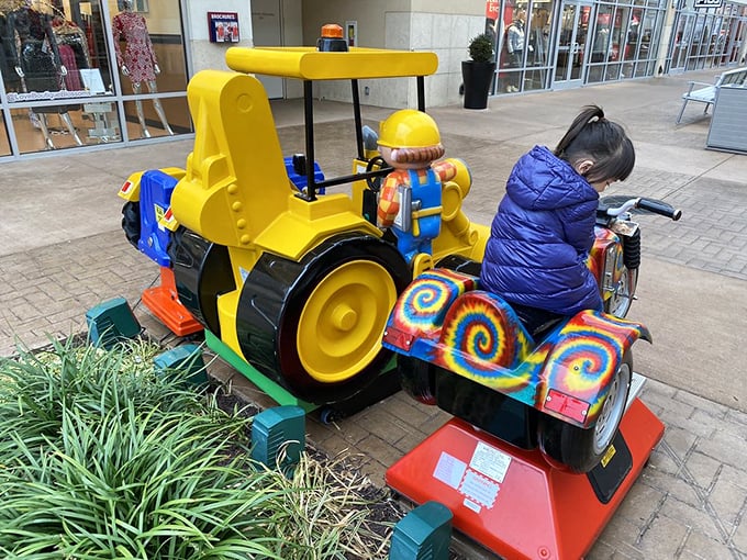 The kiddie ride—savior of shopping parents everywhere. This colorful construction vehicle buys precious minutes of additional browsing time while delighting its tiny operator.