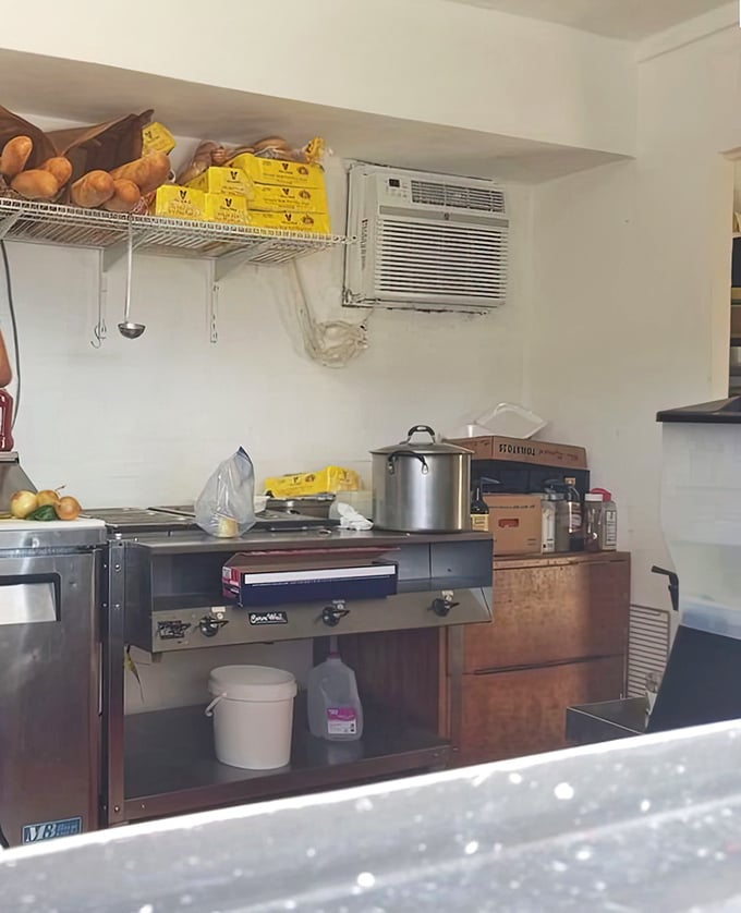 The kitchen—small but mighty. This humble workspace produces flavors that transport diners 1,200 miles north with every bite.