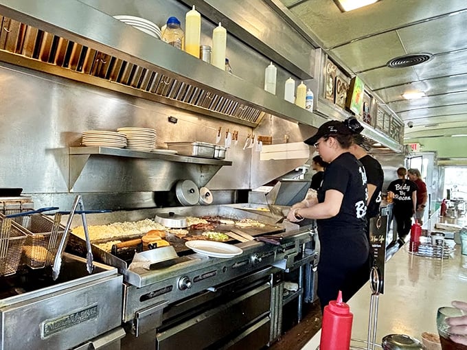 Behind the scenes, the kitchen crew orchestrates breakfast symphonies on a well-seasoned grill. Where hash browns go to achieve their golden destiny.