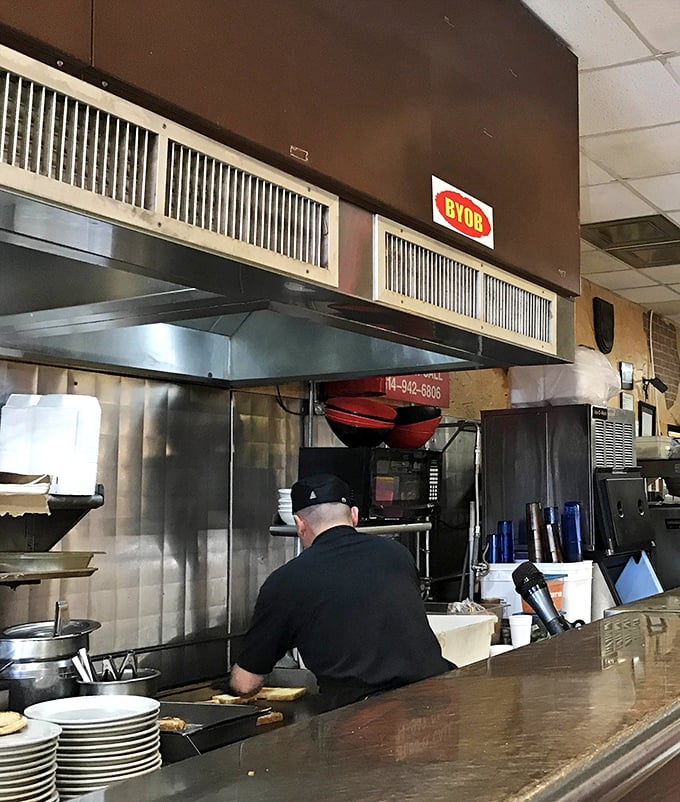 A glimpse into the kitchen where the magic happens—no molecular gastronomy, just fire, skill, and tradition.