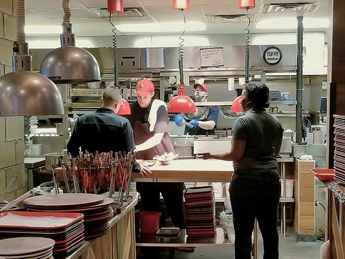 The kitchen ballet—where smoke meets fire meets skill. This is the engine room of flavor, and these are the engineers of deliciousness.