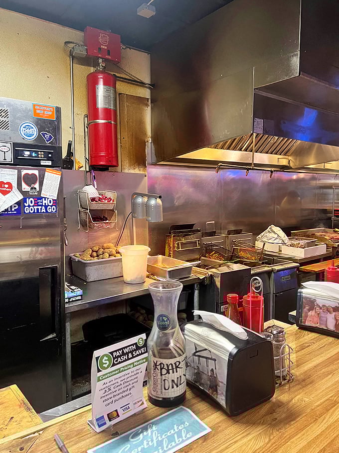 Another angle of the kitchen reveals the well-oiled machine that transforms ground beef into legends, one hand-pattied burger at a time beautifully.