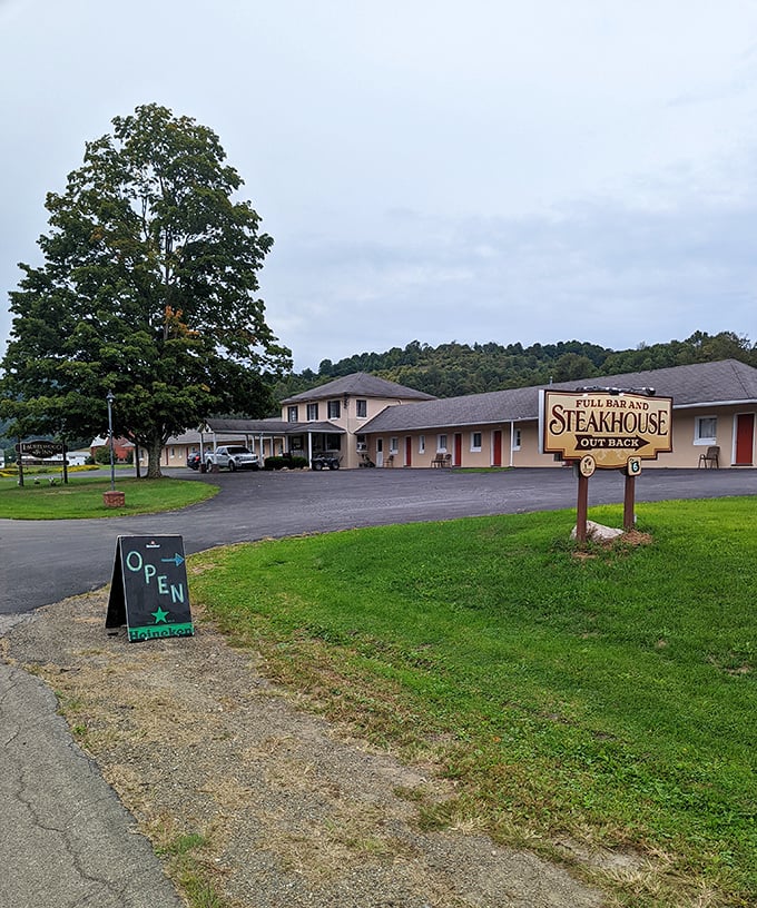 The Laurelwood Inn & Steakhouse sign promises exactly what road-weary travelers crave – a comfortable bed and a properly cooked steak after a day of exploration.