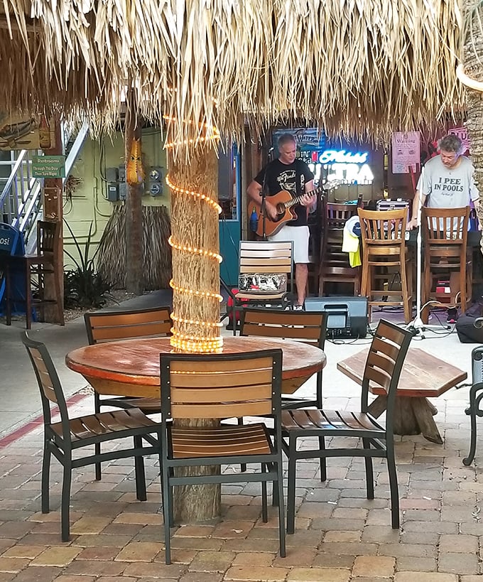 Live music under thatched palms—because fresh seafood deserves a soundtrack as laid-back and authentic as the food itself.