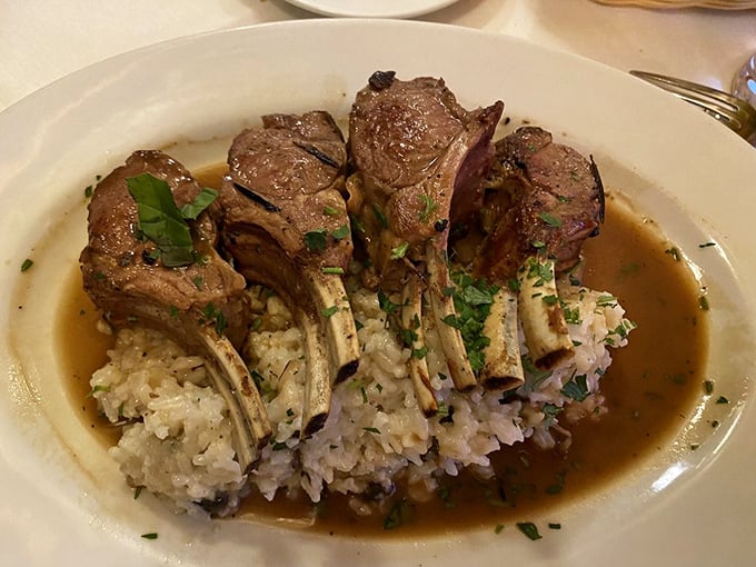 Lamb chops standing at attention like the world's most delicious fence—perfectly charred outside, blushing pink within.