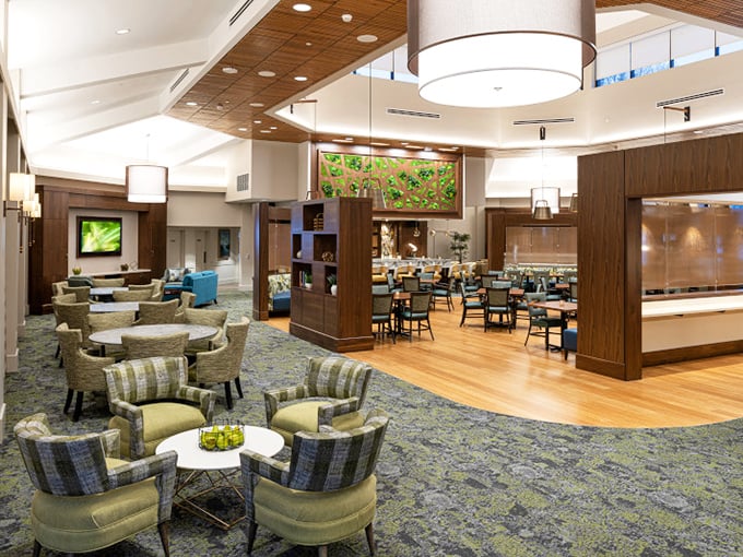 Modern dining spaces blend restaurant ambiance with community warmth—the perfect setting for both Sunday brunches and Tuesday night trivia.