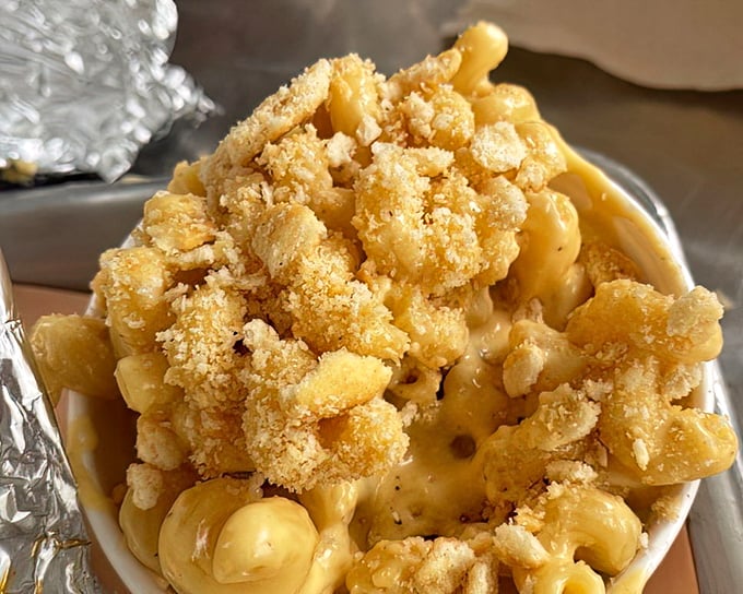 Mac and cheese with that golden crumb topping isn't just comfort food—it's therapy that doesn't require a co-pay.