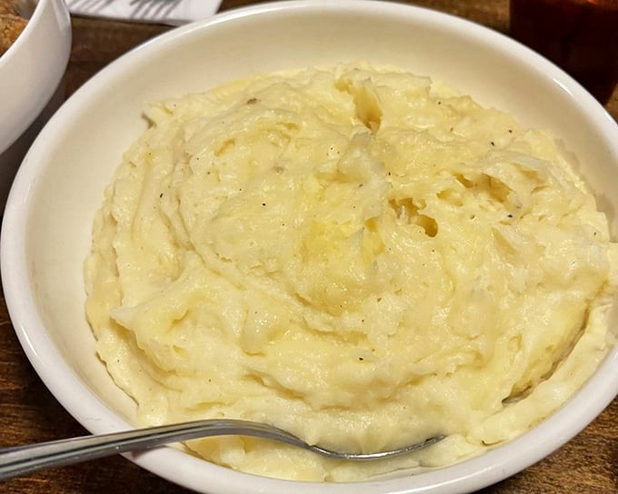 Mashed potatoes so creamy they make clouds seem lumpy by comparison. Butter isn't an ingredient here—it's a philosophy.