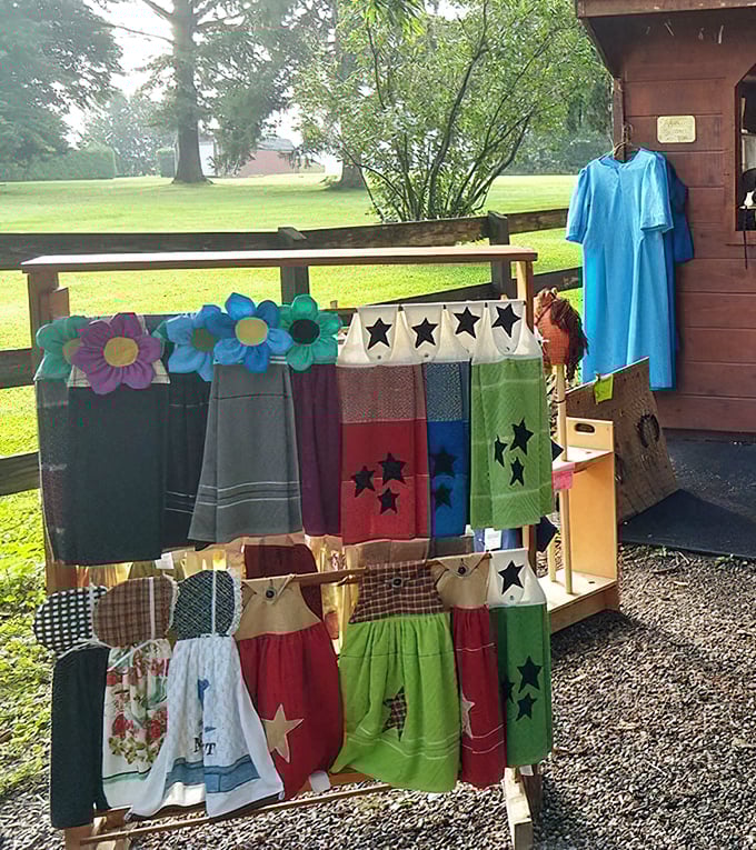 Colorful handmade Amish goods flutter in the breeze, each stitch and star representing hours of careful craftsmanship.