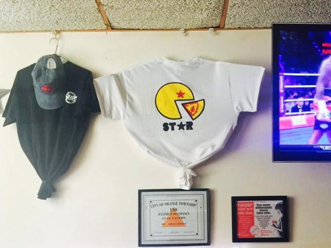 The merch wall tells the story – when your pizza inspires t-shirt sales, you've transcended from restaurant to cultural institution.
