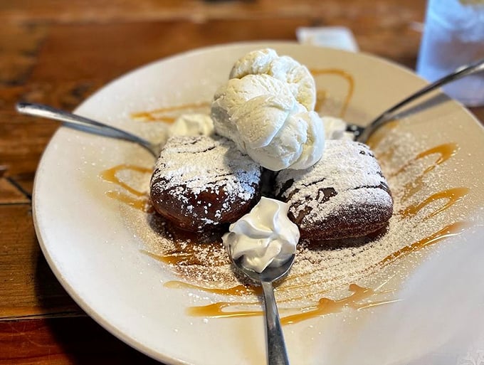 Mile High Beignets that live up to their name – pillowy perfection topped with ice cream that melts into every warm, chocolatey crevice.