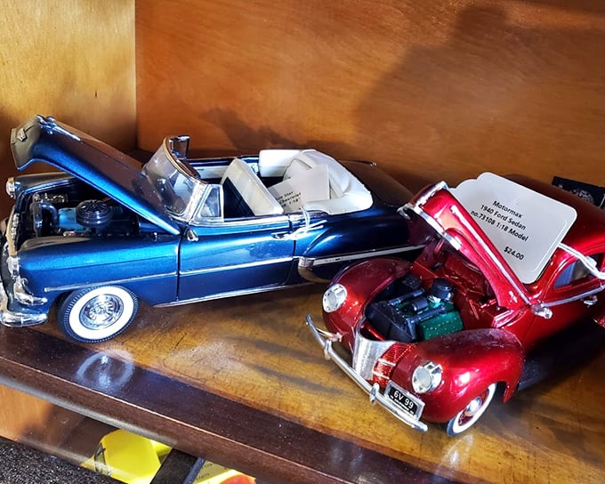 These model cars with their hoods up reveal tiny engines with impressive detail—automotive history in miniature for the discerning collector.