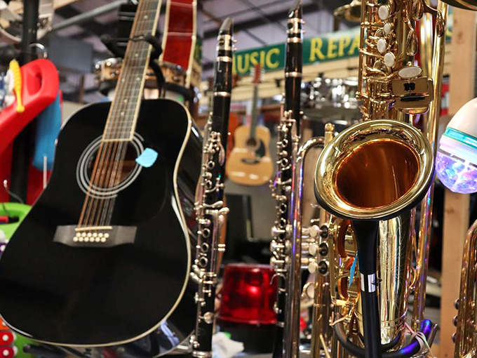Guitars and saxophones sharing space reminds you that music transcends language, just like this wonderfully diverse marketplace does.