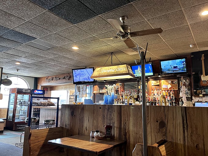 Another view of the bar's warm wood tones and multiple TVs – the Switzerland of sports bars where rival fans peacefully coexist.