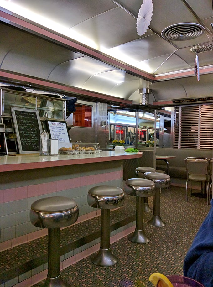 The stainless steel and pink tile interior isn't retro by design – it's authentic by survival, a living museum of American dining culture.