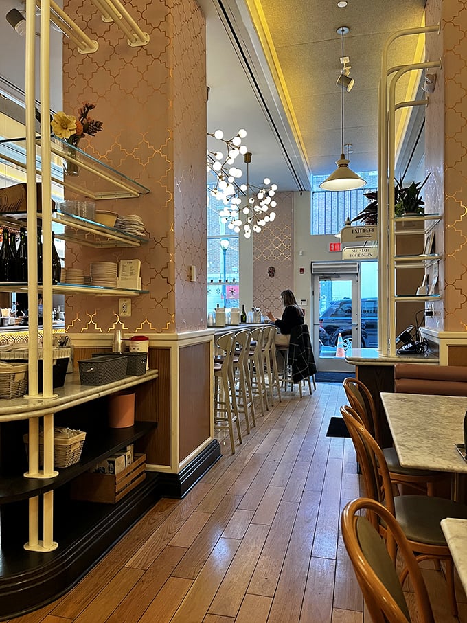 The thoughtful interior design balances modern elegance with cozy comfort – those globe lights creating the perfect atmosphere for both first dates and food photos.