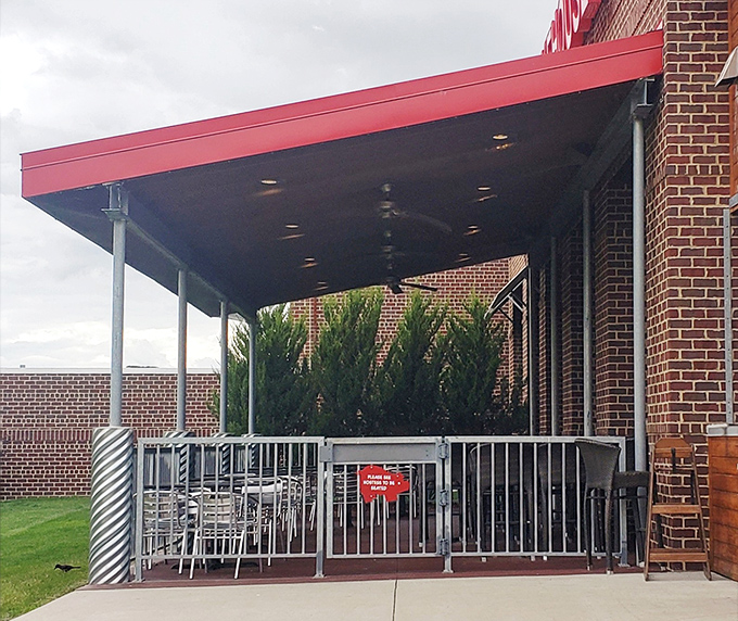 The outdoor patio offers fresh air dining—because sometimes you need nature to witness your relationship with barbecue.
