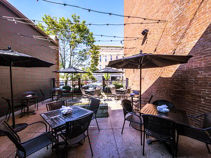The outdoor patio where summer evenings stretch deliciously long under string lights, turning simple meals into memories that sustain through winter.