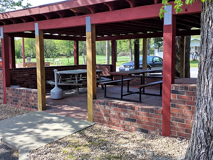 Outdoor seating under a simple red pavilion offers a place to enjoy chicken al fresco, Kansas-style.