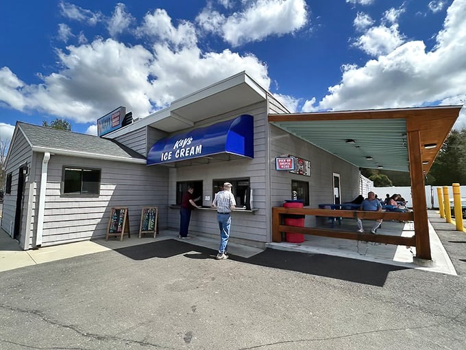 The ice cream window at Kay's – where summer dreams are served one scoop at a time under the watchful gaze of Massachusetts skies.