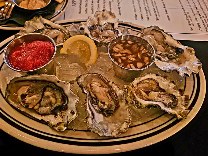 Oysters arranged like jewels on ice, with cocktail sauce standing by. The ocean meets Kentucky in this plate of briny perfection.