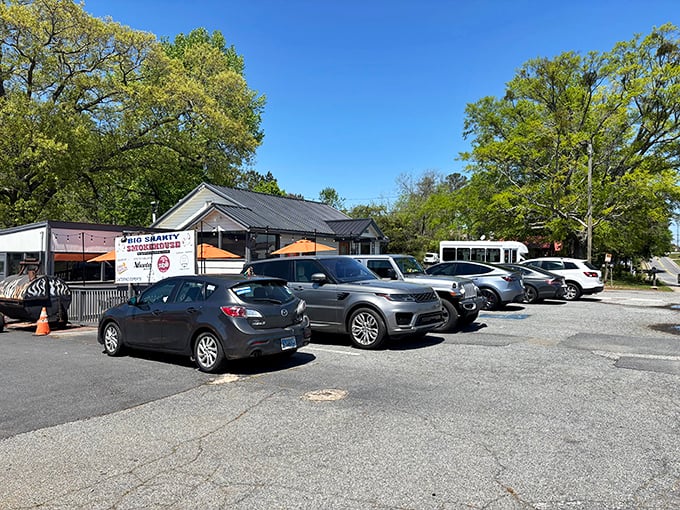 A full parking lot is the most honest review a barbecue joint can get—these cars represent people who know exactly where good eating happens.