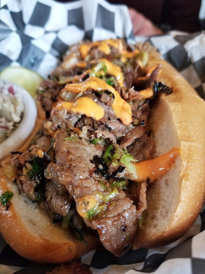 This isn't just a sandwich—it's a masterclass in meat architecture, with each layer of brisket building toward flavor nirvana.