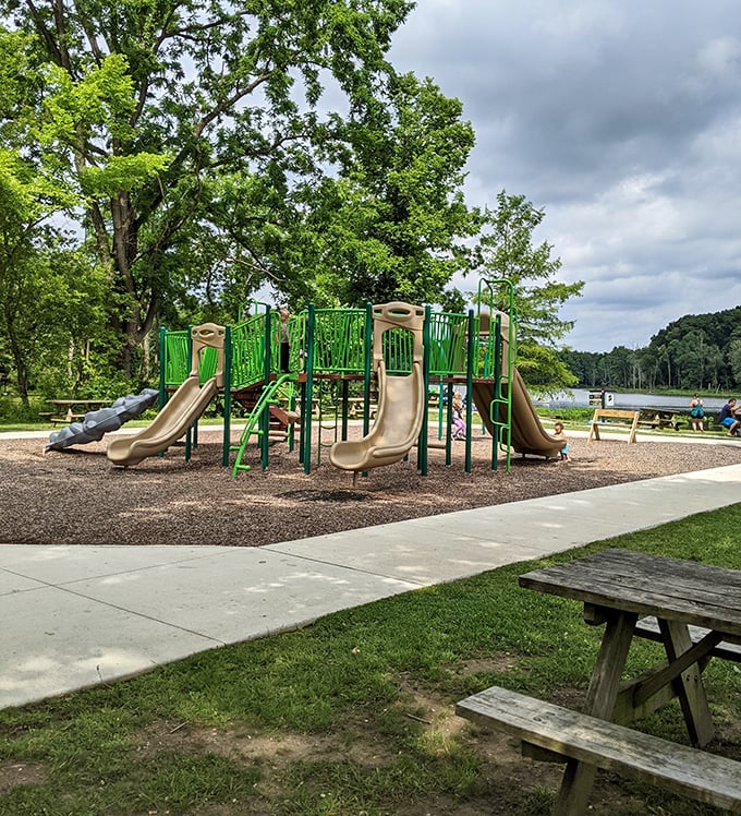 Playground physics: Where potential energy transforms into childhood joy. This lakeside play area balances fun for kids with tranquility for parents.