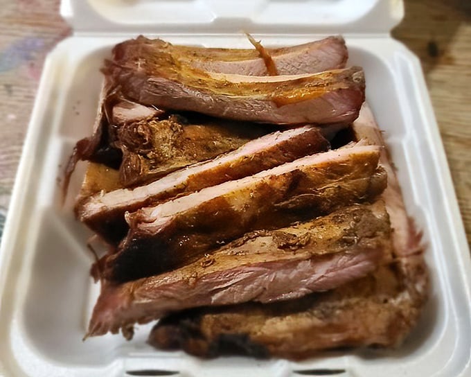 Sliced brisket with that telltale pink edge—proof that patience and proper smoking technique yield extraordinary results.
