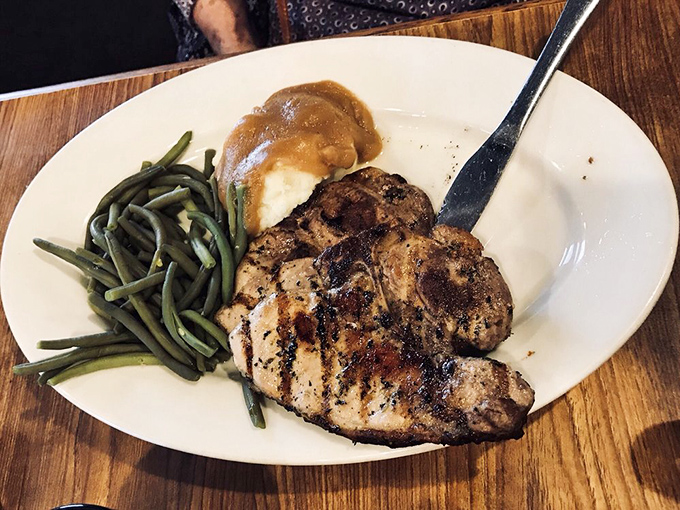 Perfectly grilled chicken breast with green beans and mashed potatoes—proof that Mickey's non-steak options deserve their own spotlight.